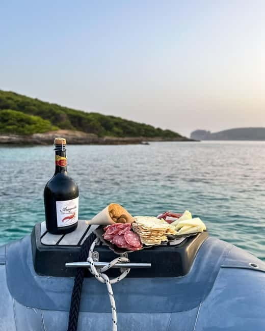 Alghero: boat tour with aperitif at sunset in Porto Conte - Key Points