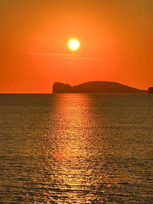 Alghero: boat tour with aperitif at sunset in Porto Conte - The Sum Up
