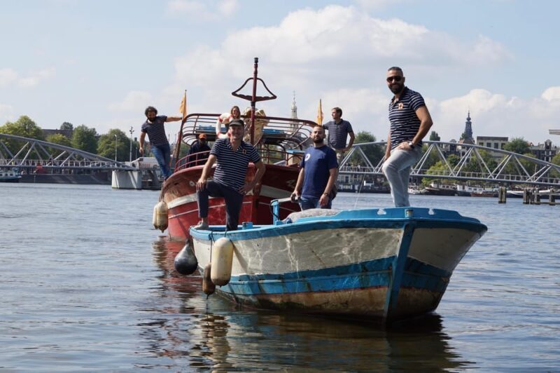 Amsterdam: Canal Cruise on a Wooden Refugee Boat - The Sum Up