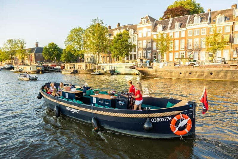 Amsterdam: Guided Open Boat Canal Cruise Including Drink - The Sum Up