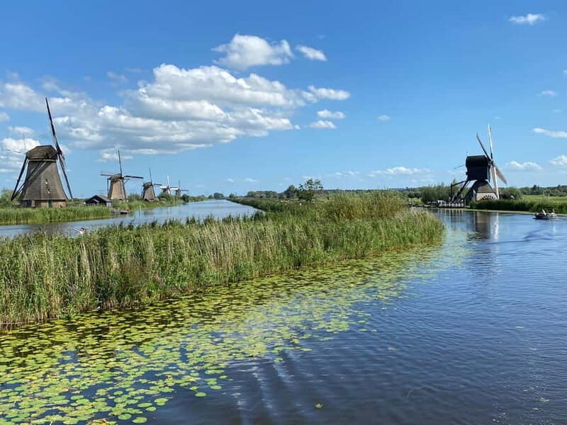 Amsterdam: Kinderdijk, Euromast, Delft and Den Haag Day Tour - Practical Tips for Travelers