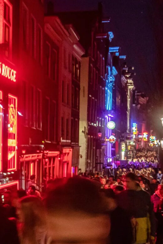 Amsterdam: Spanish Tour Unmasking the Redlight District - Key Points