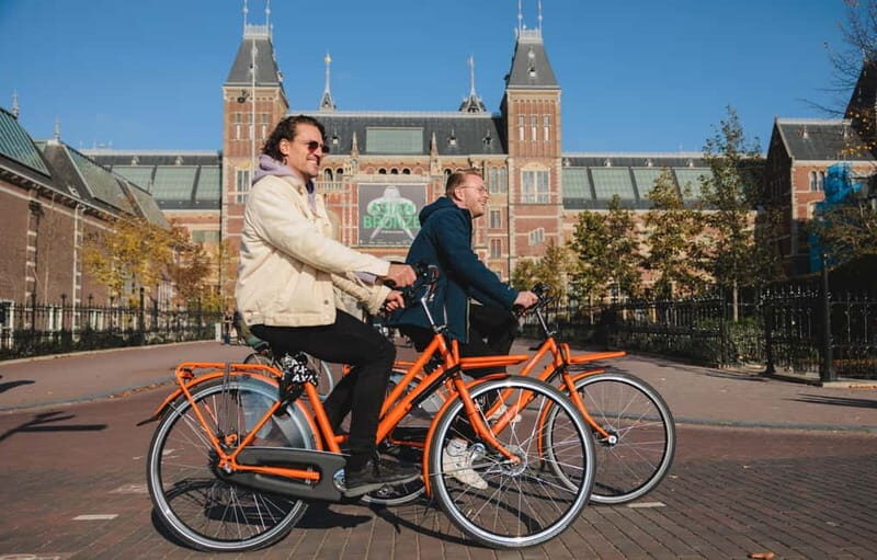 Amsterdam: Top Highlights Guided Bike Tour EN/DE/ES/FR/IT/CN - The Sum Up