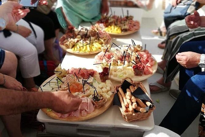Aperitif on the boat at Sunset island and sea caves - Why This Tour Stands Out