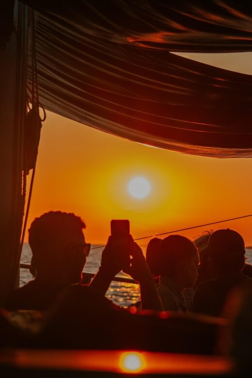 Argostoli: Sunset Cruise with Swim Stops, Dinner, and Wine - Key Points