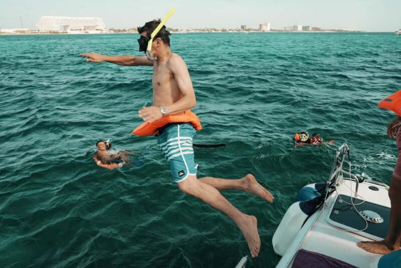 Cancun: Isla Mujeres Adults Only Party Catamaran with Drinks - The Beach Club Buffet and Music