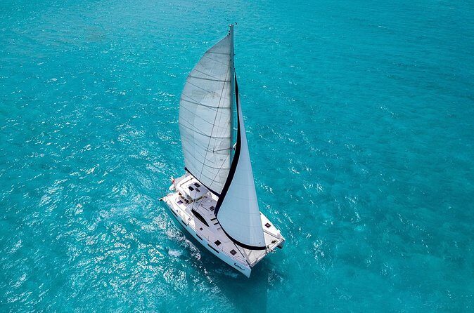 Catamaran Snorkeling and Lunch Tour to Isla Mujeres Included - Return Voyage and Final Relaxation