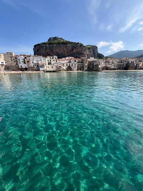 Catamaran tour along the Cefalù coast with aperitif and snorkeling - Key Points