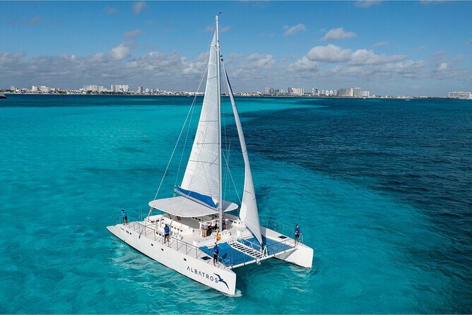 Catamaran Tour to Isla Mujeres Open bar and Lunch - Key Points
