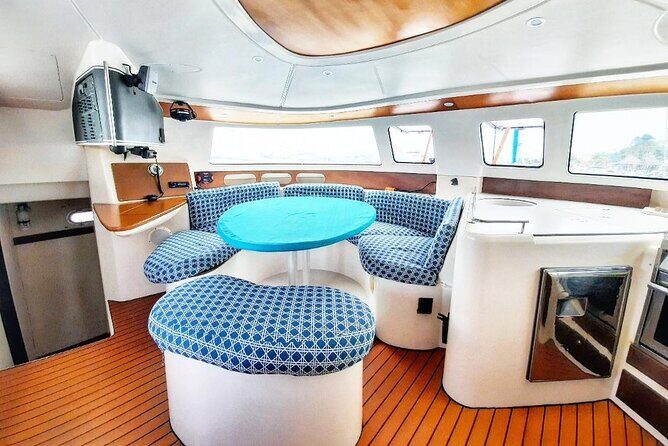 Catamaran Tour to Isla Mujeres Snorkeling with Buffet and Open Bar - Key Points