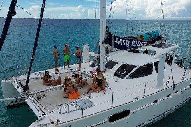 Catamaron Sunset Tour on Isla Mujeres with Snorkeling - Key Points
