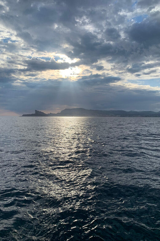 Departure from BRUSC sunset on sailing catamaran - Key Points