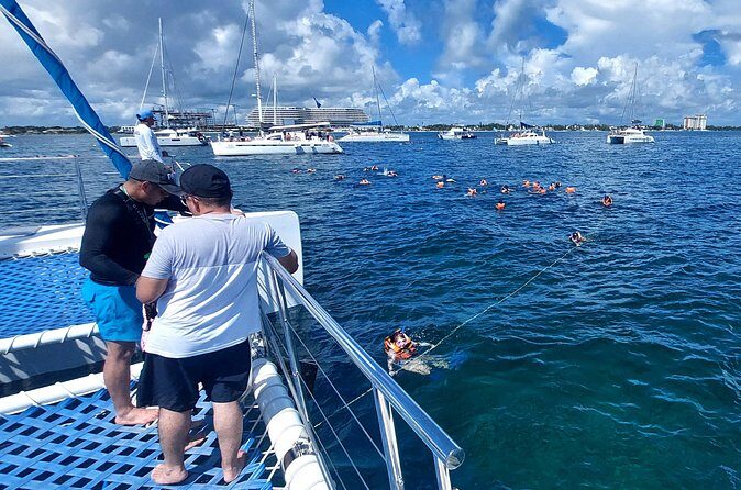 Discover Isla Mujeres on an All inclusive Catamaran tour - Beach Club & Lunch: Relaxation & Delicious Food