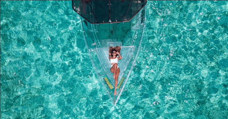 Explore the sea of cozumel in a transprent boat with drinks and snorkel. - A closer look at the Cozumel transparent boat tour