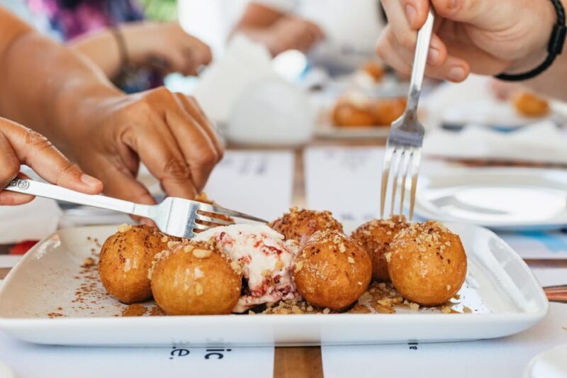 Fira: Guided Foodie Walking Tour with Tastings - Key Points