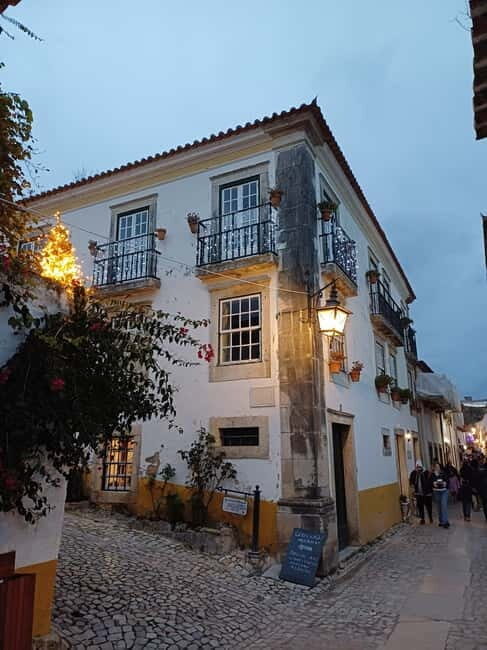 From Lisbon: Porto Transfer with Óbidos & Nazaré Tours - Key Points