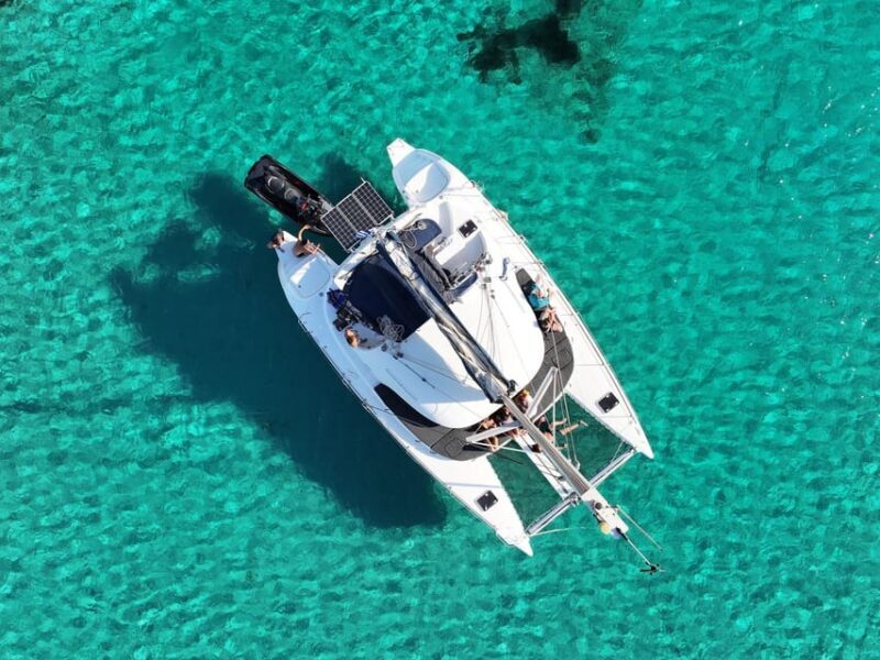 From Ornos: Mykonos Delos Catamaran Cruise with Meal & SUP - The Sum Up