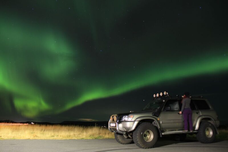 From Reykjavík: Spot the Northern Lights with Snacks & Drink - Key Points
