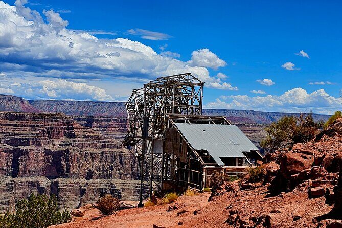 Grand Canyon West Rim, Hoover Dam Stop and 7 Magic Mountains Tour - Key Points