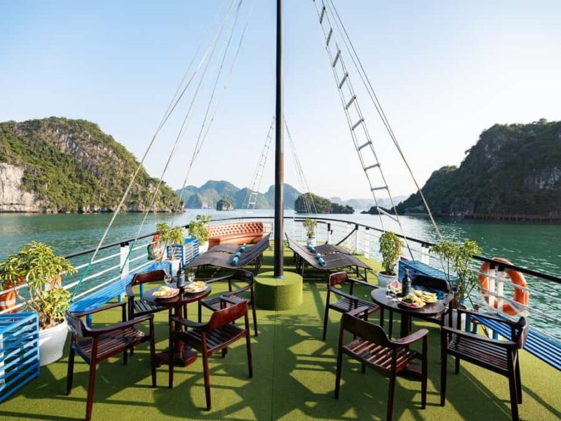 Halong Bay: Day Cruise with Caves, Kayaking & Sunset Party - Titop Island: Beach, Hike, and Views