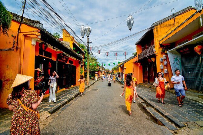 Heritage Train Adventure Hue to Hoi An with Lantern Experience - Wandering Hoi An’s Historic Streets and Markets