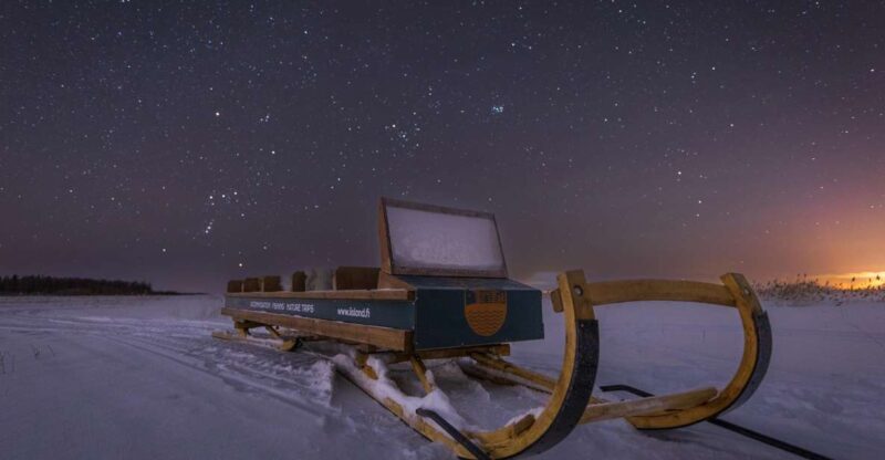 Ii: Snowmobile sleigh trip on frozen sea under starlit sky - The Journey into Arctic Night: What to Expect