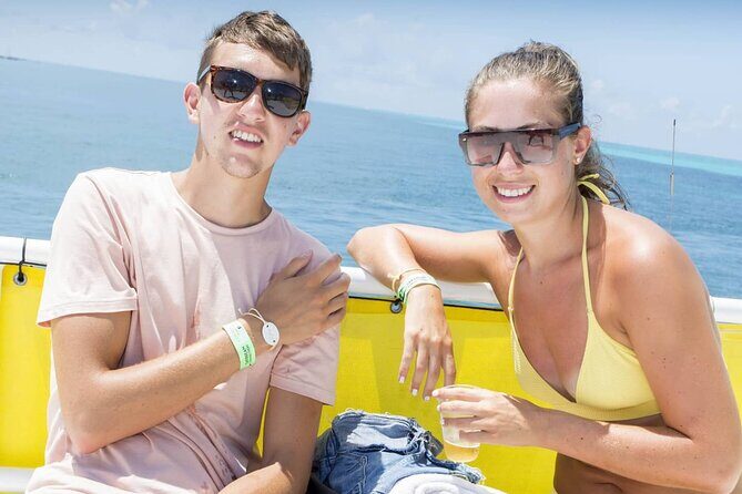 Isla Mujeres Private Catamaran with Food and Drinks Round Trip - The Sum Up