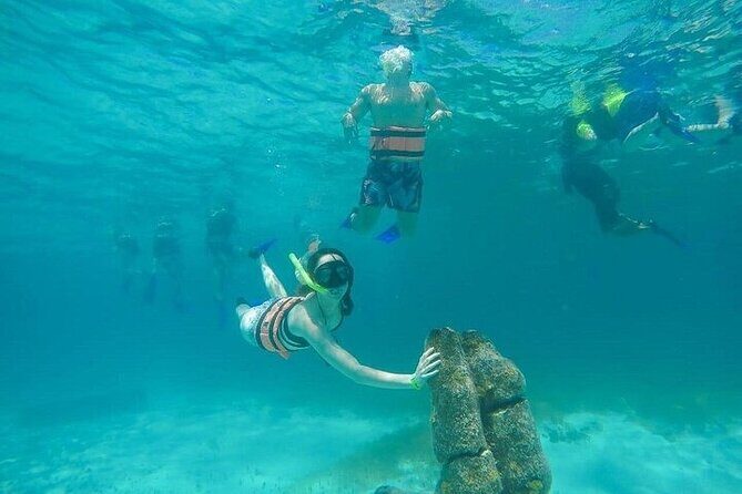 Isla Mujeres Tour with buffet, open bar and snorkeling Sunken Boat - The Sum Up