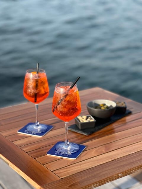 Italian aperitif at the sunset by the sea - Key Points