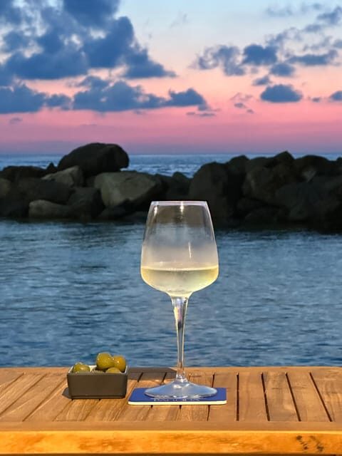 Italian aperitif at the sunset by the sea - The Experience in Detail