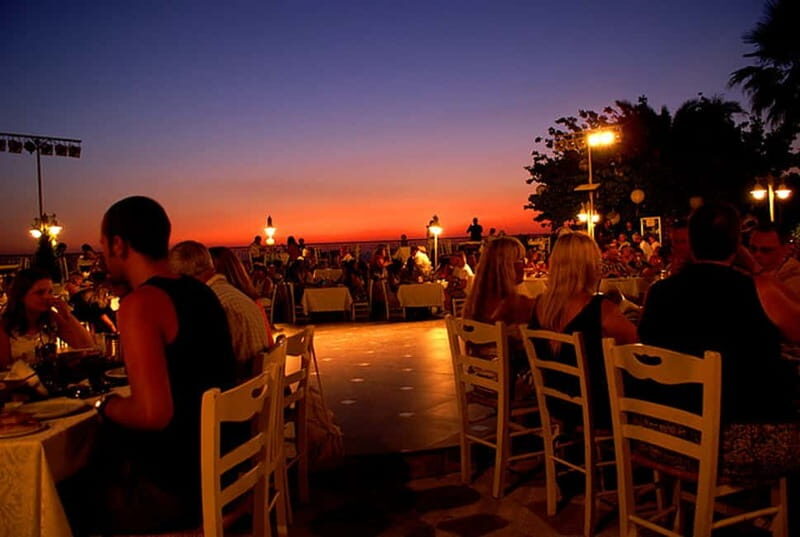 Kos: Greek Dinner with Music, Dancing, and Unlimited Wine - Key Points