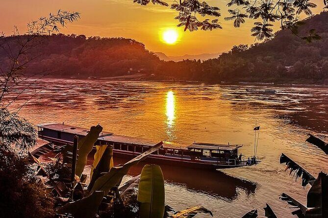 Kuangsi waterfall with sunset view Mekong cruiser Pakou Cave - A Day Filled with Natural and Cultural Wonders