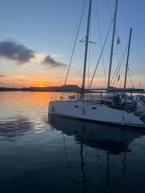 La pelosa: Sunset catamaran tour with aperitif - Key Points