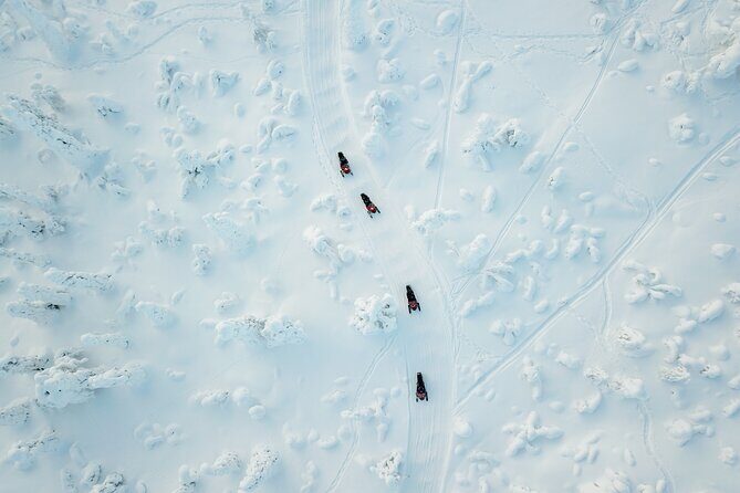 Lappish Lunch Break -Snowmobiling, ice fishing and tasty food - A Practical Look at the Tour Experience