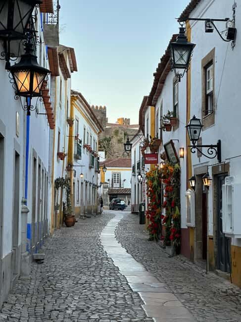 Lisbon: Grutas de Mira de Aire, Fátima, Nazaré & Óbidos Tour - Authentic Experiences and Practical Tips