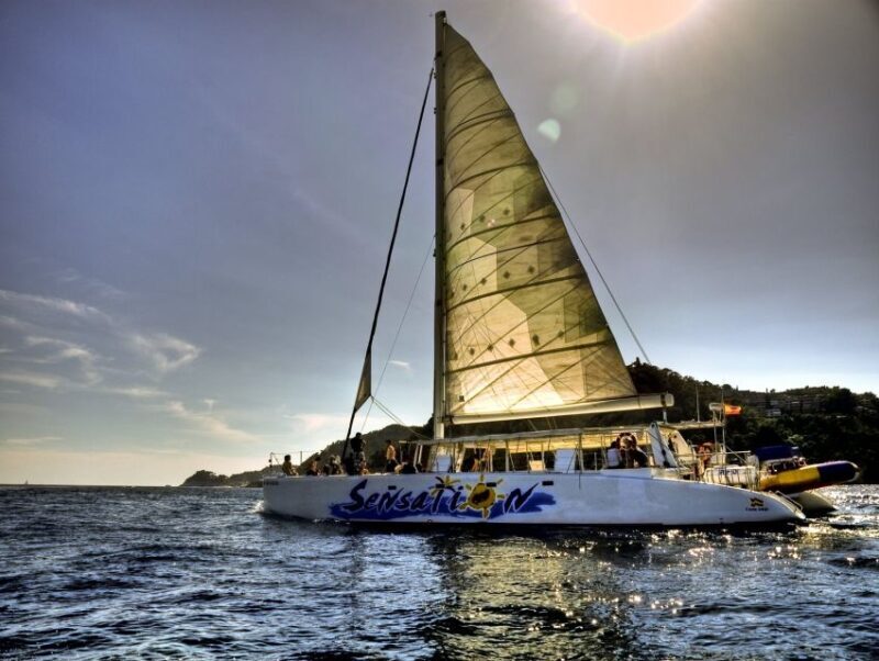 Lloret de Mar: Sunset Catamaran Cruise with DJ and Drinks - Key Points