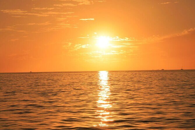 Los Cabos Sunset Catamaran Cruise with Open Bar & Light Snack - Onboard Atmosphere and Entertainment