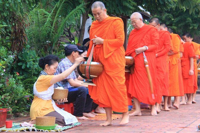 Luang Prabang Alm Giving, Temples and Pak Ou Caves Private Tour - Returning to Town