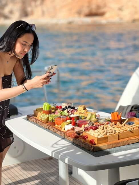 Majorca: Dinner aboard a private catamaran with snorkeling and paddle surfing - Key Points
