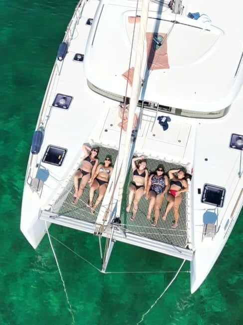 Majorca: Dinner aboard a private catamaran with snorkeling and paddle surfing - An Authentic Mallorca Experience on the Water