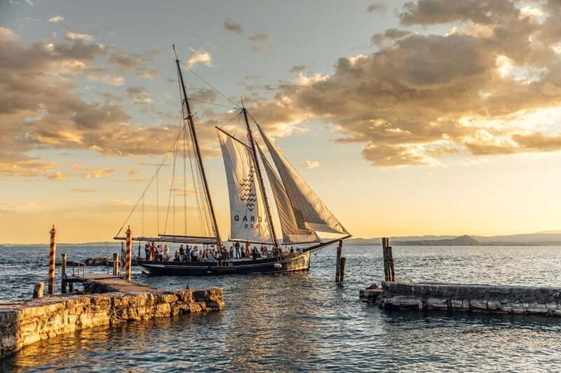 Malcesine: Golden Sunset Cruise with Food, Drinks & Music - Key Points