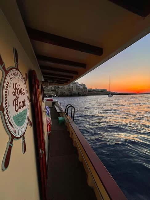 Monopoli-Polignano: sunset boat tour on a traditional wooden boat - Experience the Coast on a Timeless Wooden Vessel