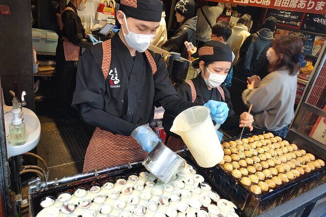Osaka Kuromon MarketTakoyaki Cooking Experience PRIVATE Tour - The Glico Sign: Osaka’s Iconic Landmark