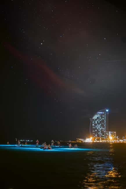 Paddle surf at night with light & drink -photos &videos - An Authentic Night on the Water: What to Expect