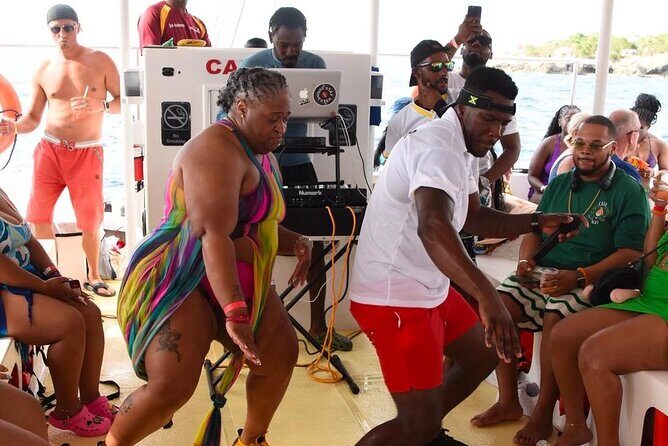 Party Catamaran: OpenBar, Music, Negril Beach, Caves, Snorkeling - End of the Day: Ricks Cafe Sunset and Return
