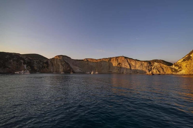 Ponza: Sunset by boat with aperitif and swim at Chiaia di Luna - Key Points