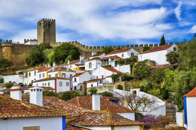 Porto: Berlengas Islands, Óbidos Castle and Peniche Day Trip - Exploring Óbidos: Medieval Charm and Sweet Traditions