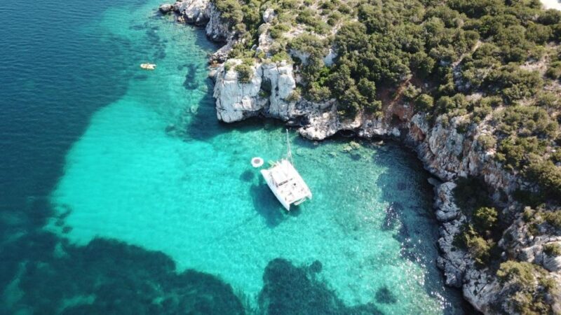 Porto Conte: Half-day catamaran tour with aperitif - The Sum Up