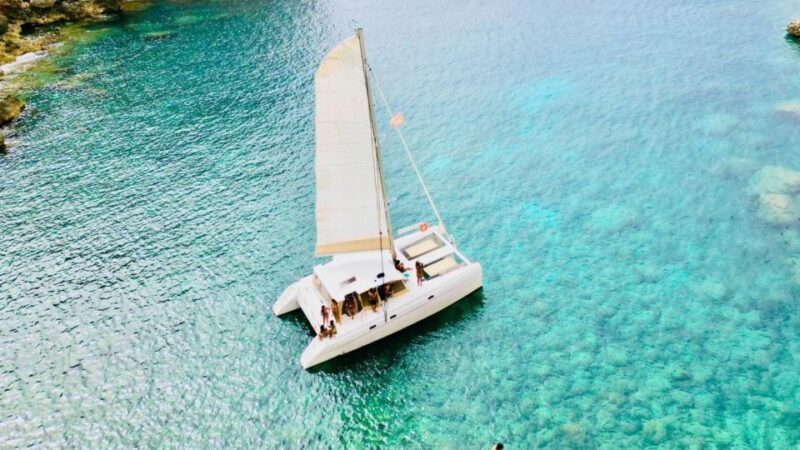 Porto Conte: Sunset catamaran excursion with aperitif - Key Points