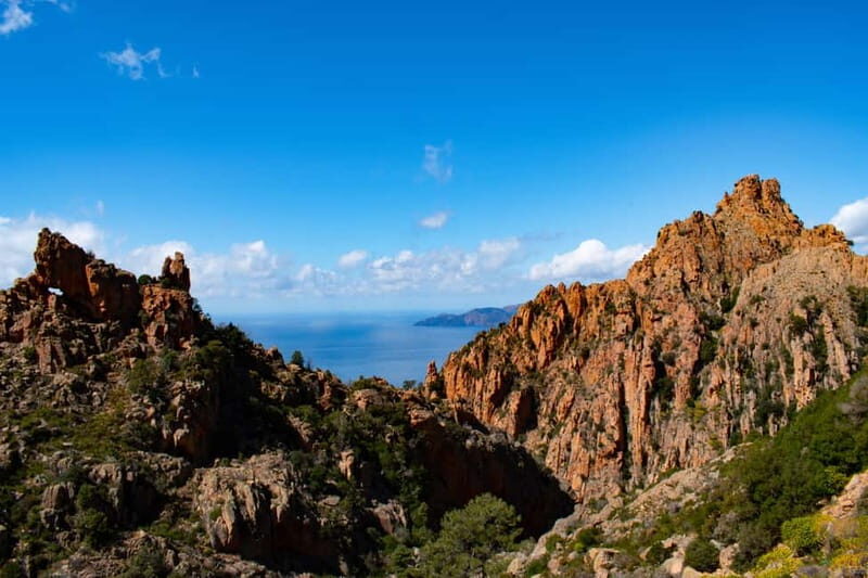 Porto: Creeks of Piana & Capo Rosso Guided Boat Tour - The Capo Rosso Peninsula and Its Scenic Highlights